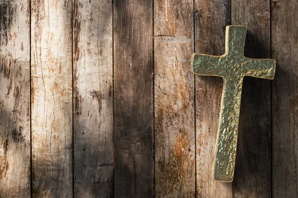 Wooden cross on brown old tabletop or wall surface Stock Photo by ...