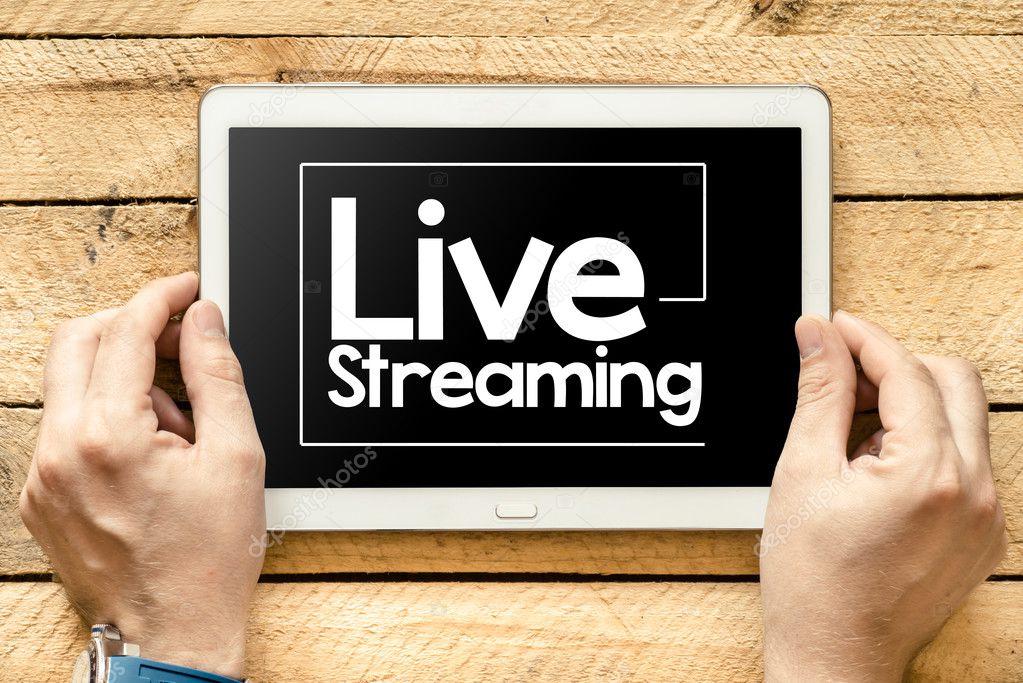 Live streaming on tablet screen in hands — Stock Photo © roobcio #125658470