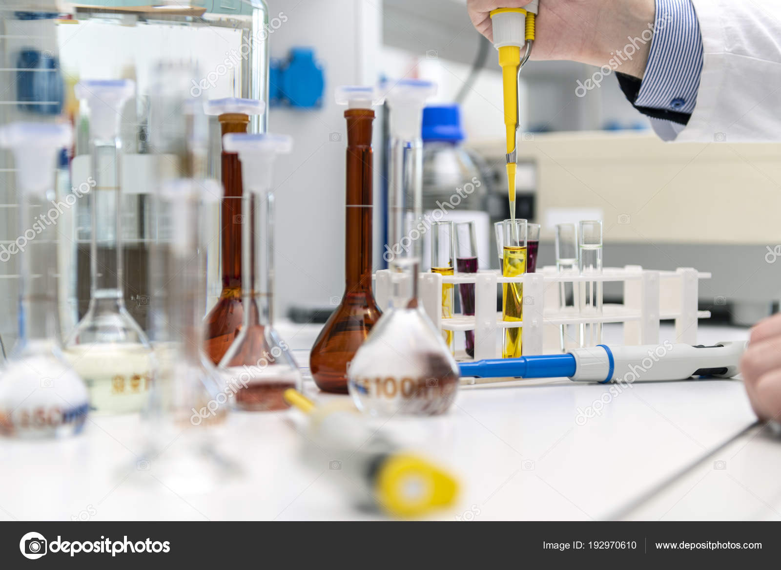 Hands with dropper examining samples in medical laboratory, Stock Photo ...