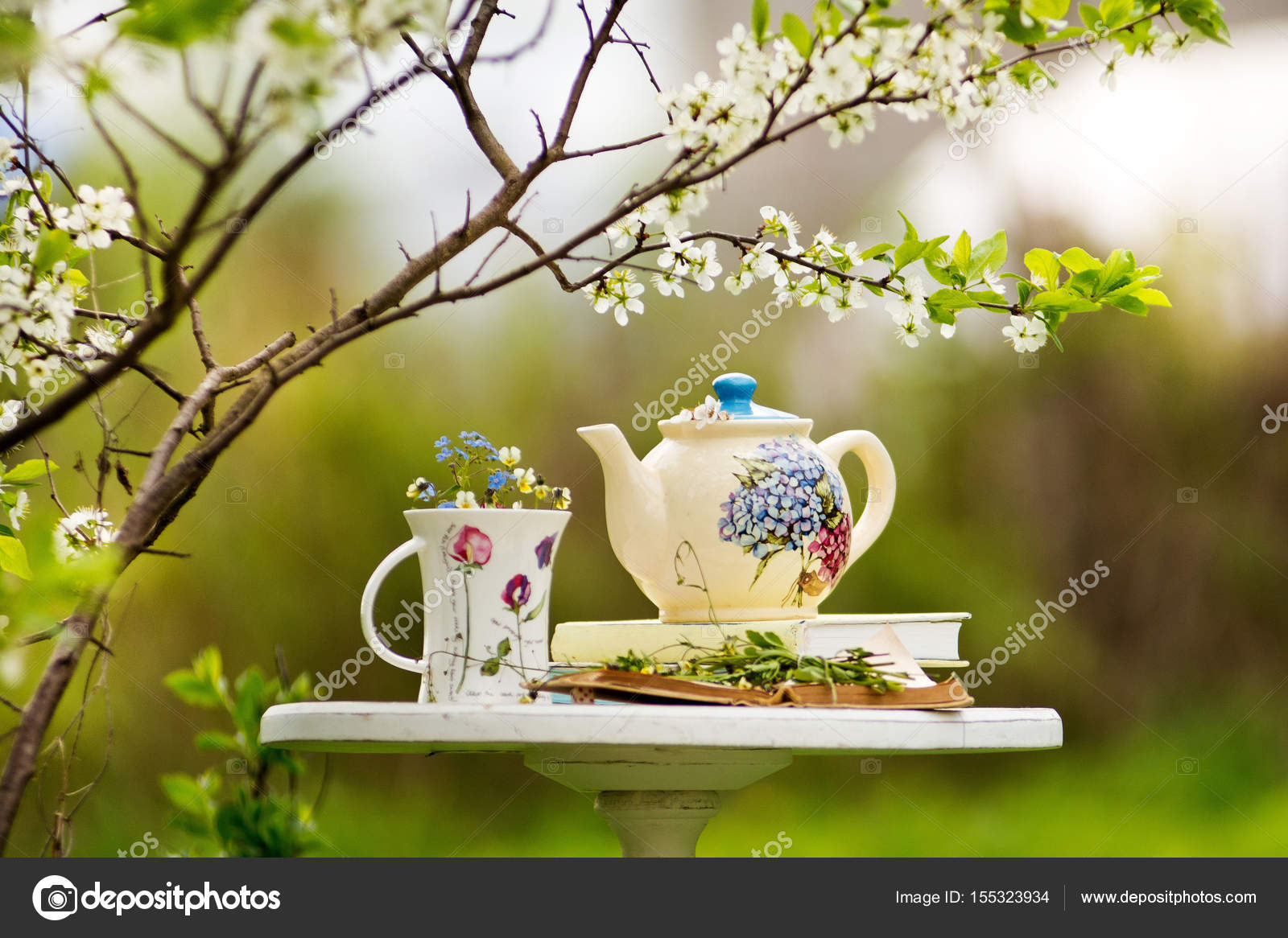 Tea drinking under the tree Stock Photo by ©Shangarey 155323934