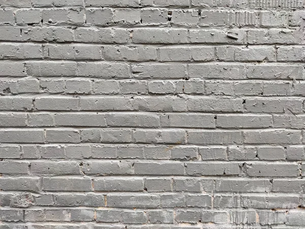 Painted brick wall of an architectural structure in light gray color ...