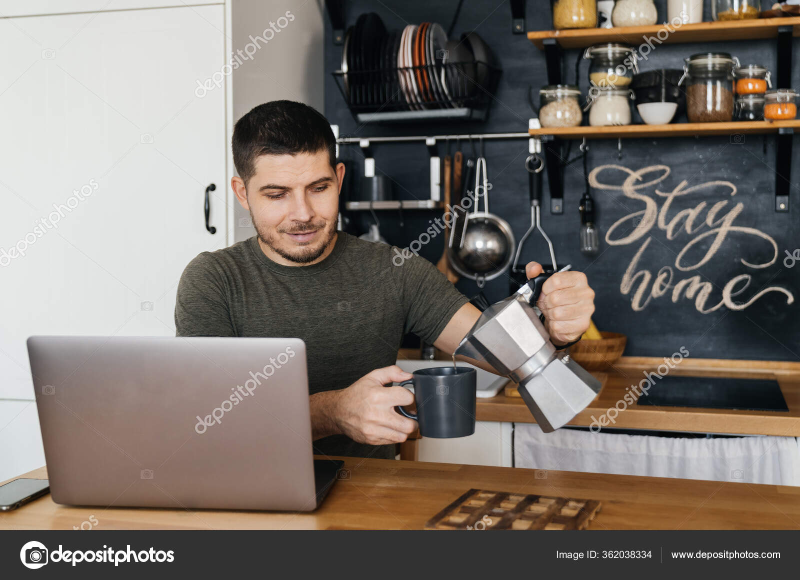 Man Works Laptop Interior Home Kitchen Pours Himself Coffee Remote ...