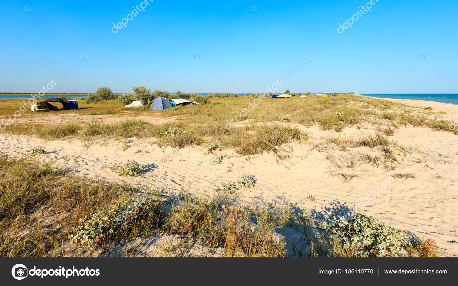 Camping in sandy prairie between lake and sea — Stock Photo © wildman ...