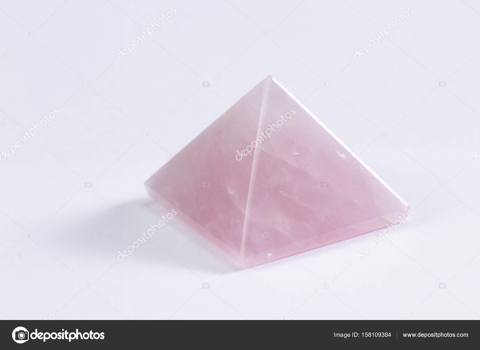 Rose quartz pyramid — Stock Photo © wollertz #158109384