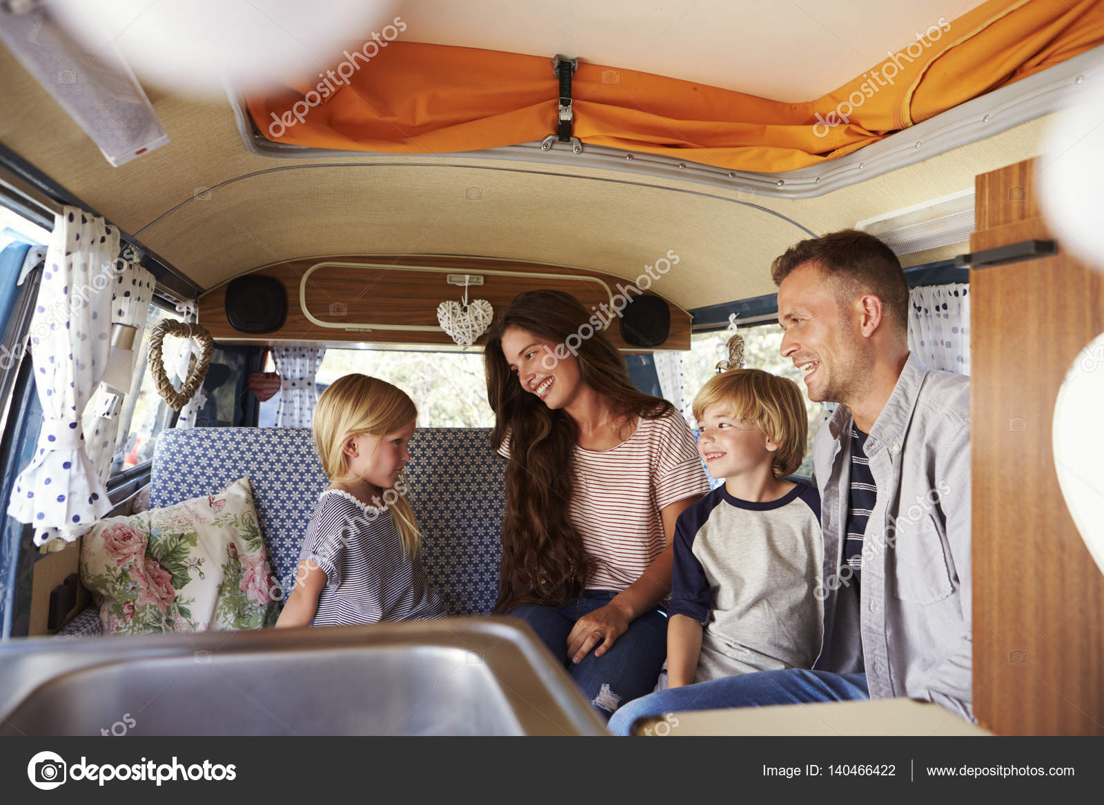 Family sitting inside camper van Stock Photo by ©monkeybusiness 140466422