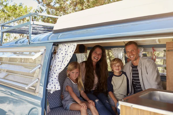 Family sitting inside camper van — Stock Photo © monkeybusiness #140466424