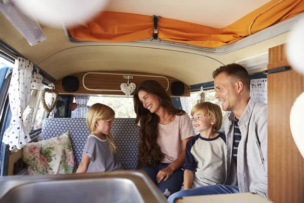 Family sitting inside camper van — Stock Photo © monkeybusiness #140466424