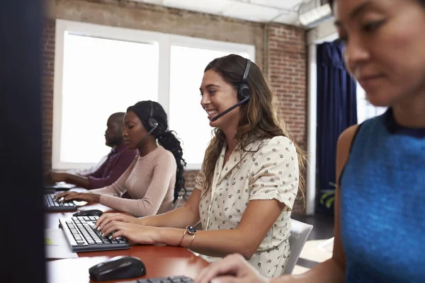 Staff Working In Busy Customer Service Department Shot - Stock Image ...