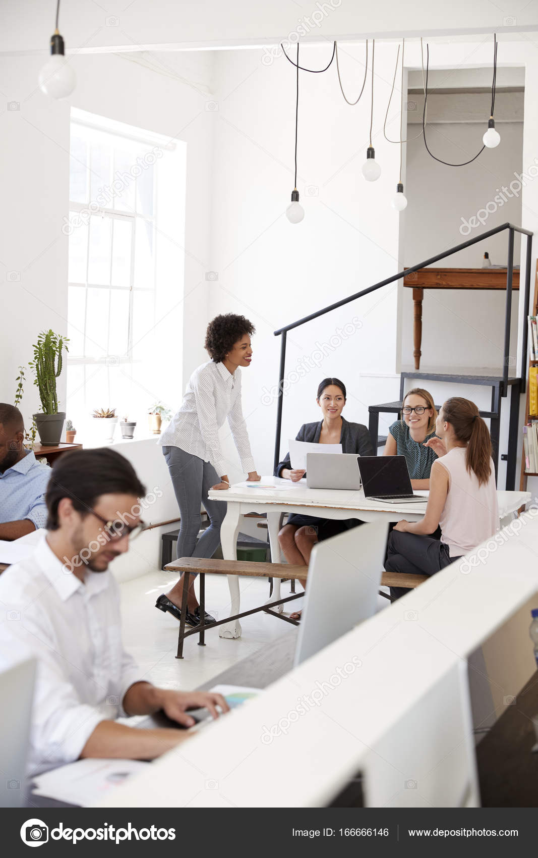 Woman briefing colleagues Stock Photo by ©monkeybusiness 166666146