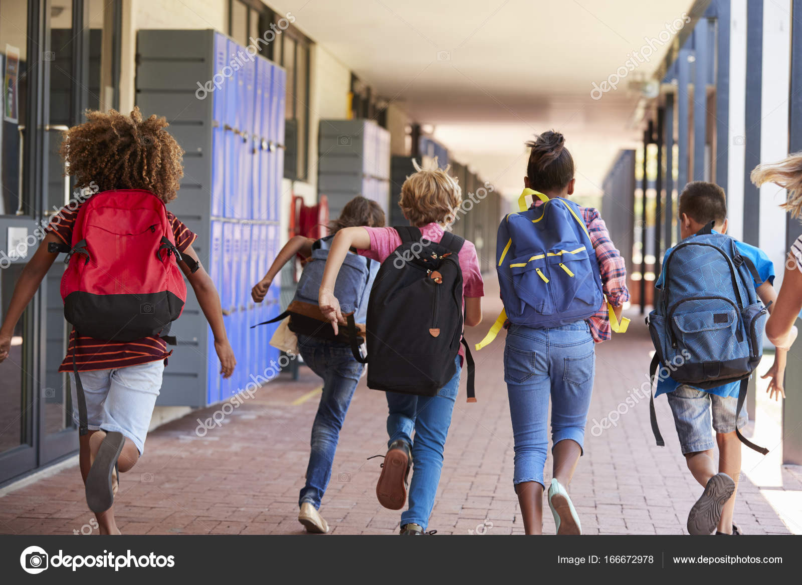 Elementary Students Walking In Hallway