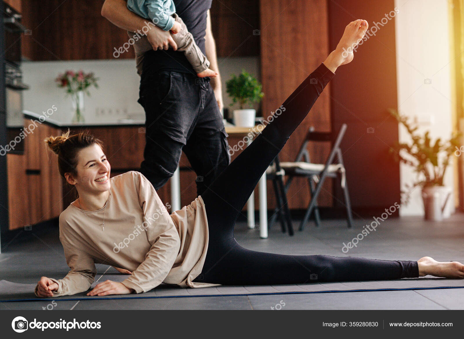 Mother Doing Side Leg Raises While Father Walks Carrying Infant — Stock ...