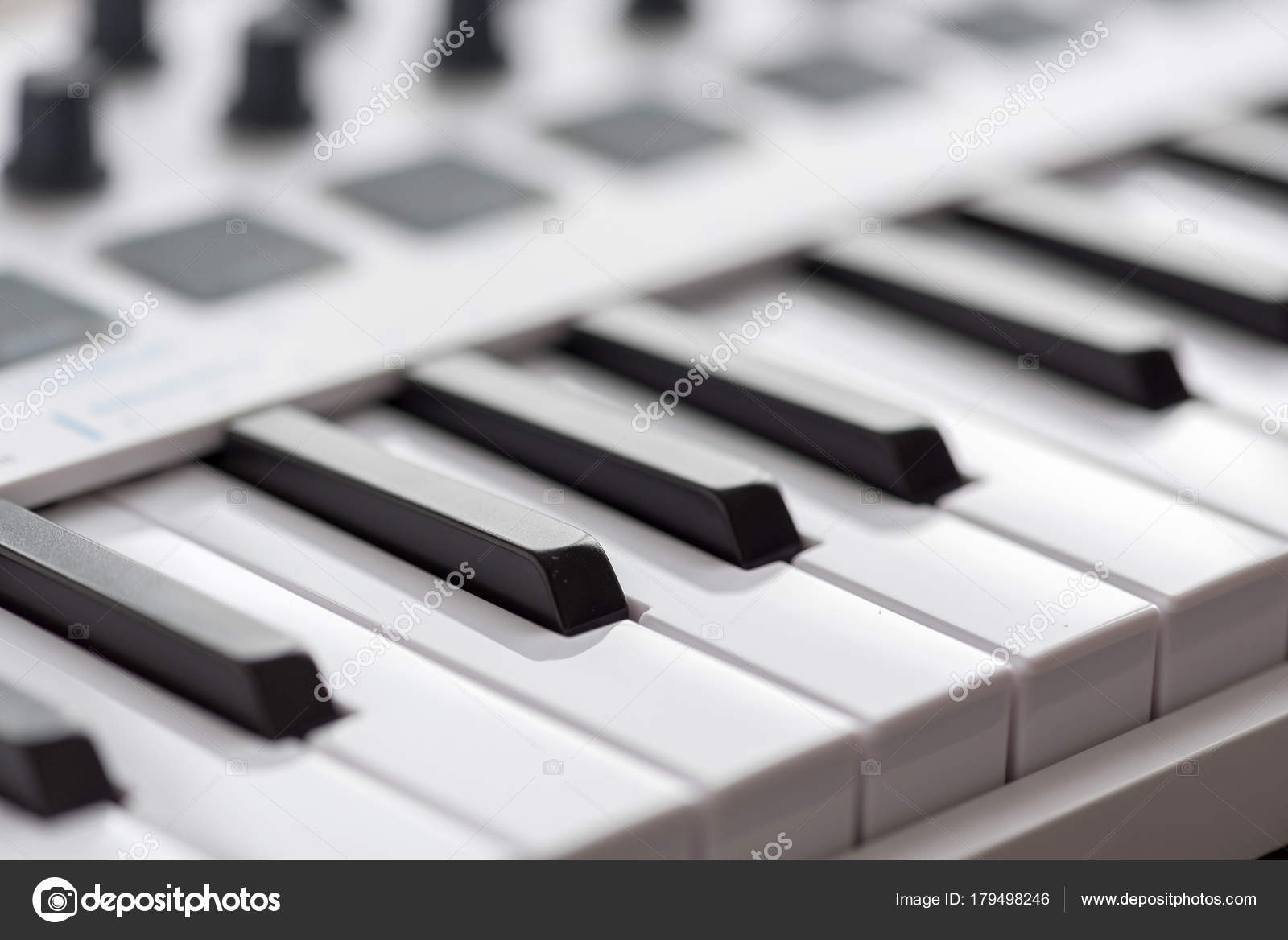 MIDI keyboard with pads and faders. — Stock Photo © thirteen #179498246