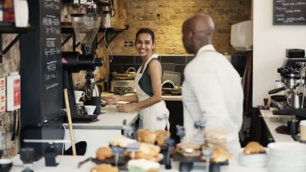 Smiling worker standing behind counter — Stock Video © Hotelfoxtrot ...
