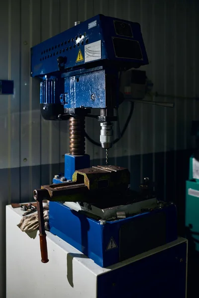 Drilling machine in a car workshop. - Stock Image - Everypixel