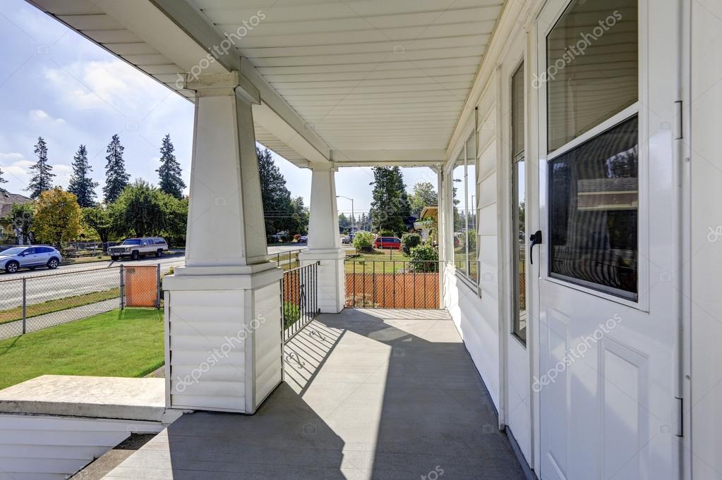 Covered column porch interior overlooking road — Stock Photo ...