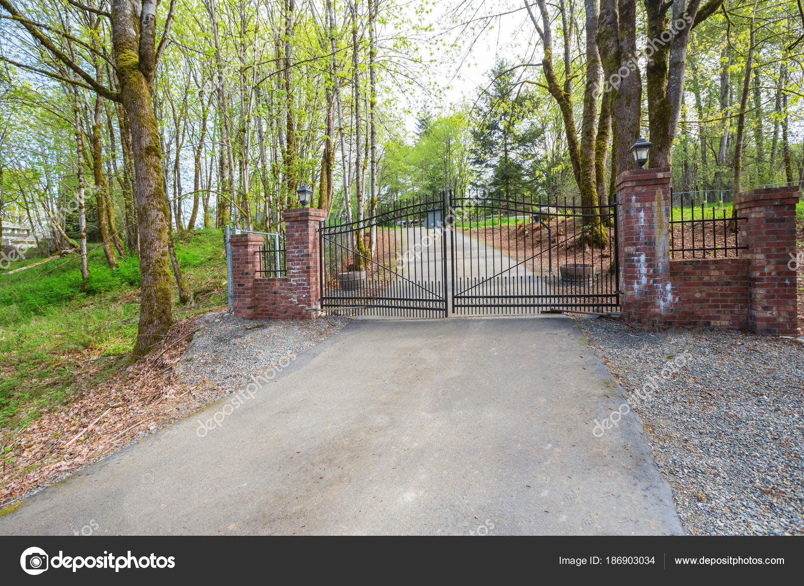 Rod Iron Gate With Brick Pathway