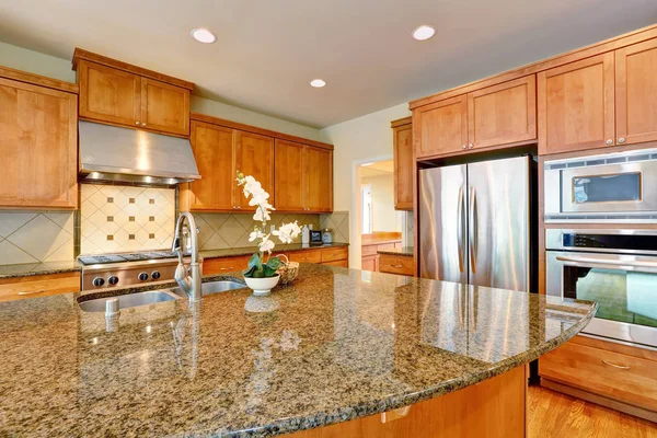 Bright Inviting kitchen features granite counters. - Stock Image ...