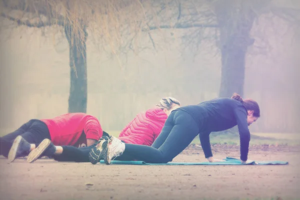 People doing keep fit exercise in park - Stock Image - Everypixel
