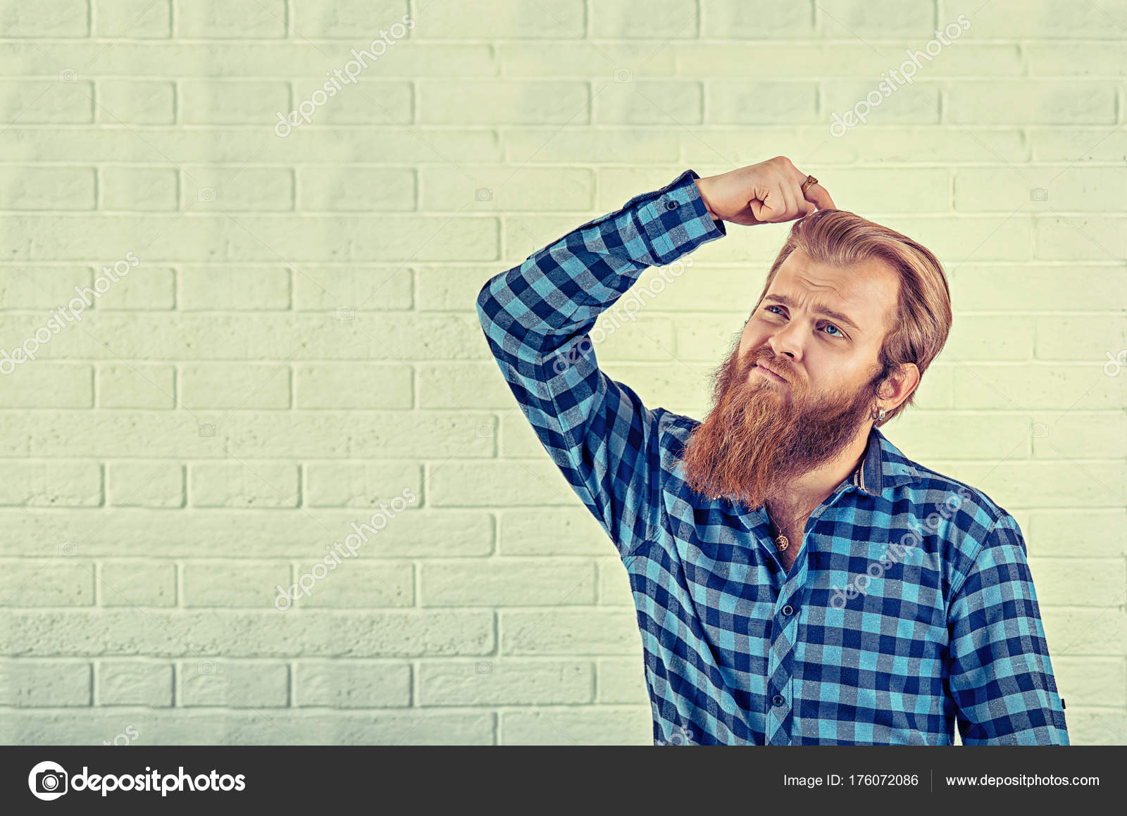 Closeup portrait young man scratching head thinking deeply about ...