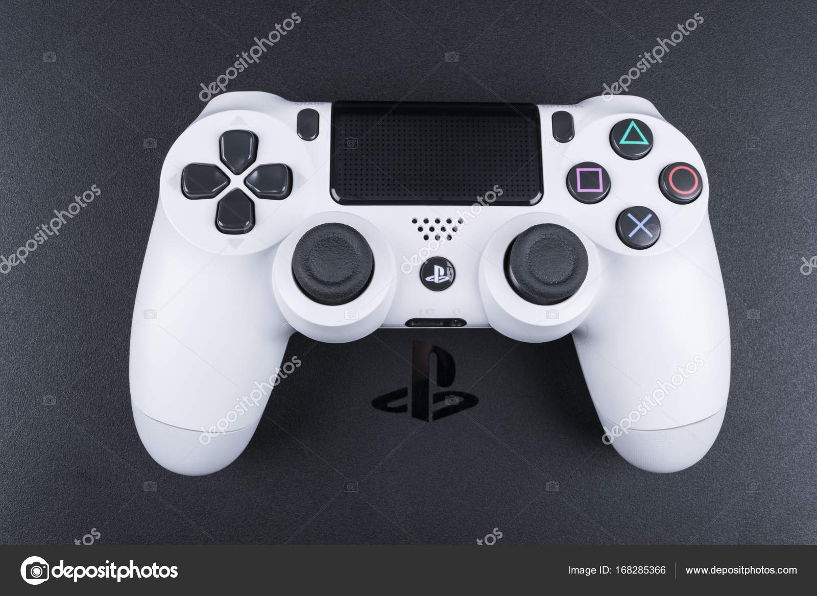 Sony PlayStation 4 Slim 1Tb revision and dualshock game controller. Game console with a joystick ...