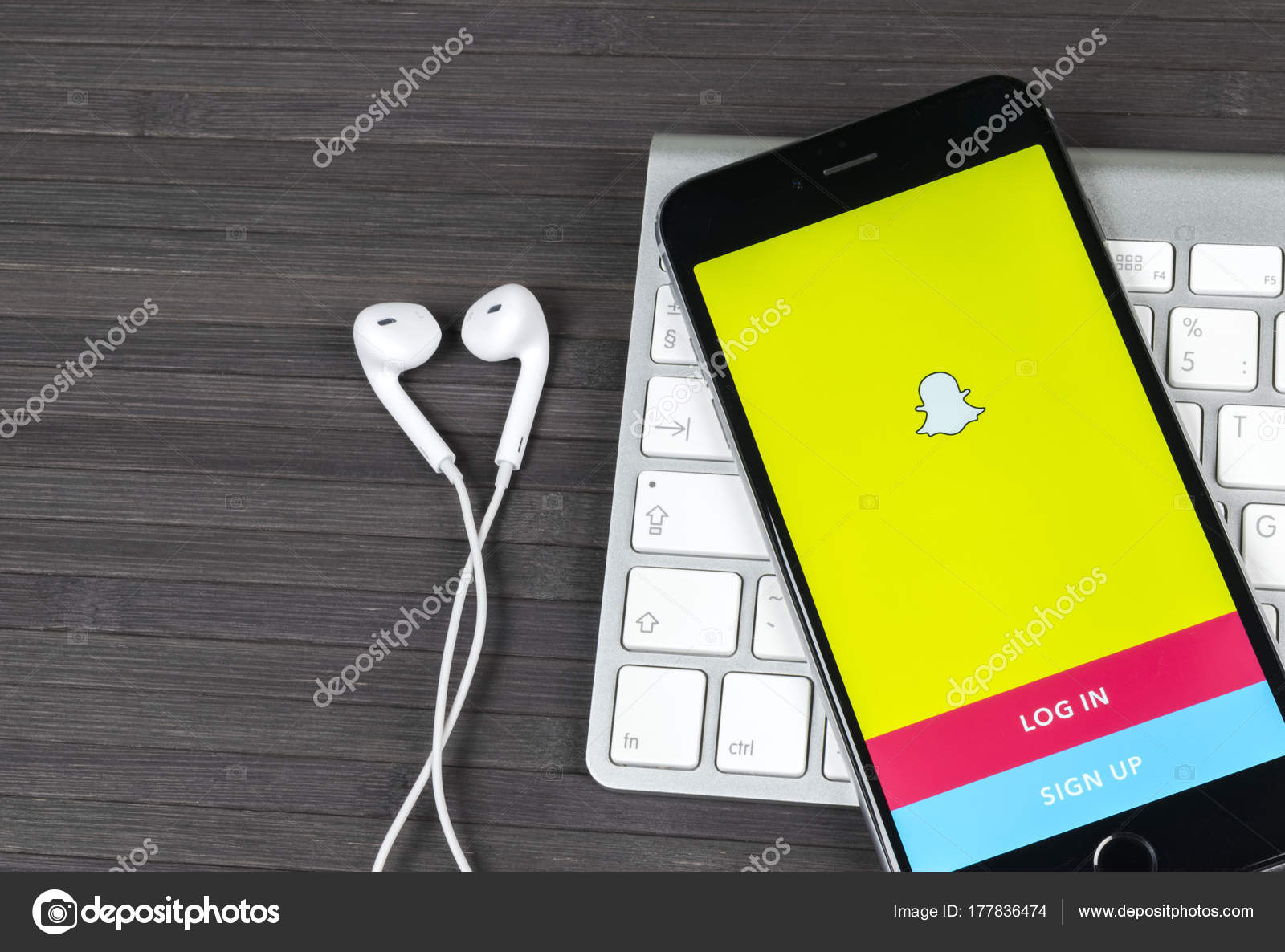 Apple iPhone 7 with Snapchat homepage on monitor screen. Snapchat is ...