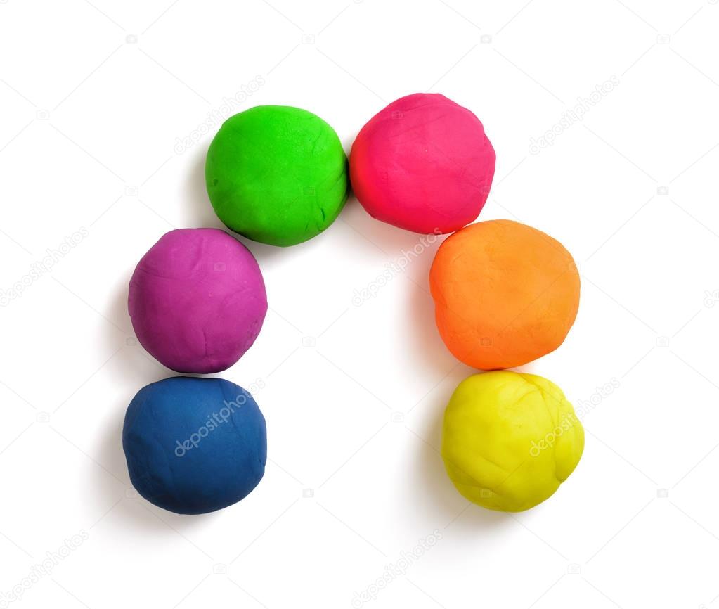 Arch made with colorful balls of modelling clay isolated on white ...