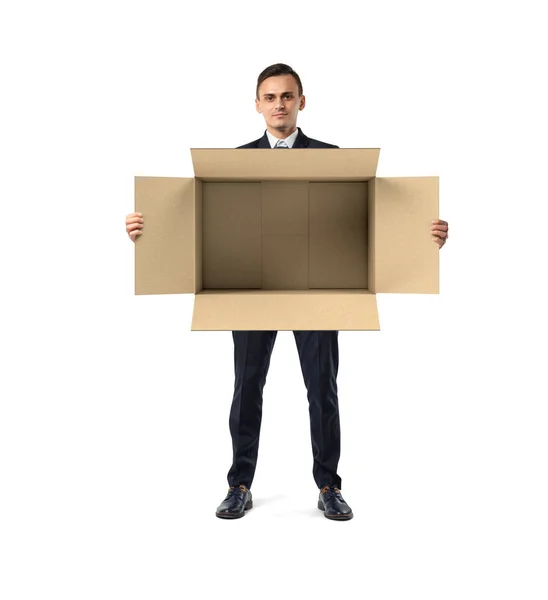 Frightened businessman and empty boxes falling on him Stock Photo by ...