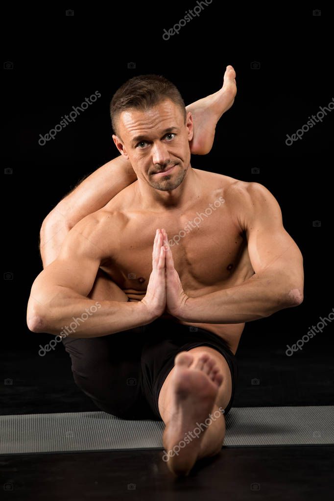 Man sitting in yoga position — Stock Photo © OlgaZakrevskaya #135644672
