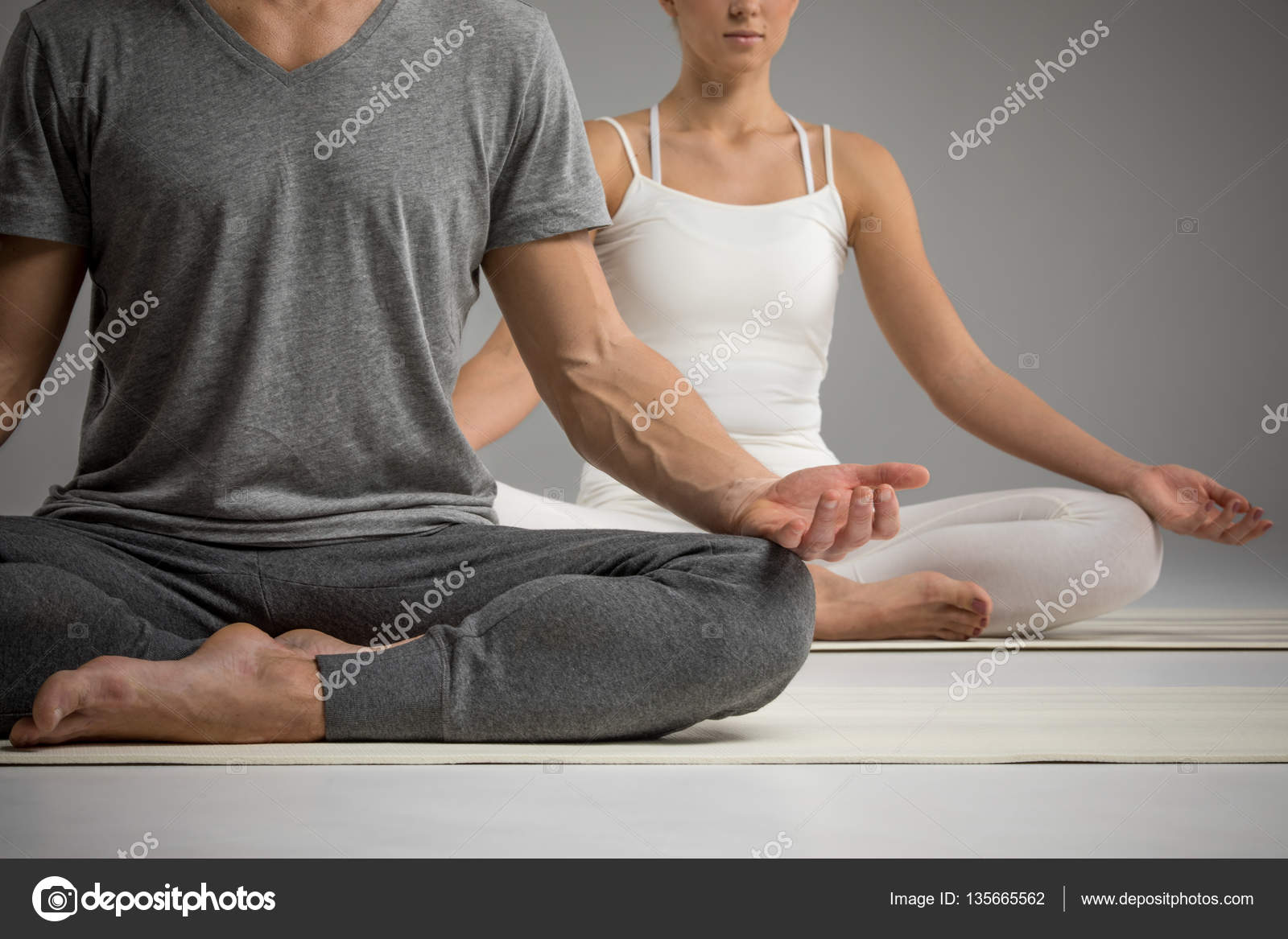 Couple sitting in lotus position — Stock Photo © OlgaZakrevskaya #135665562