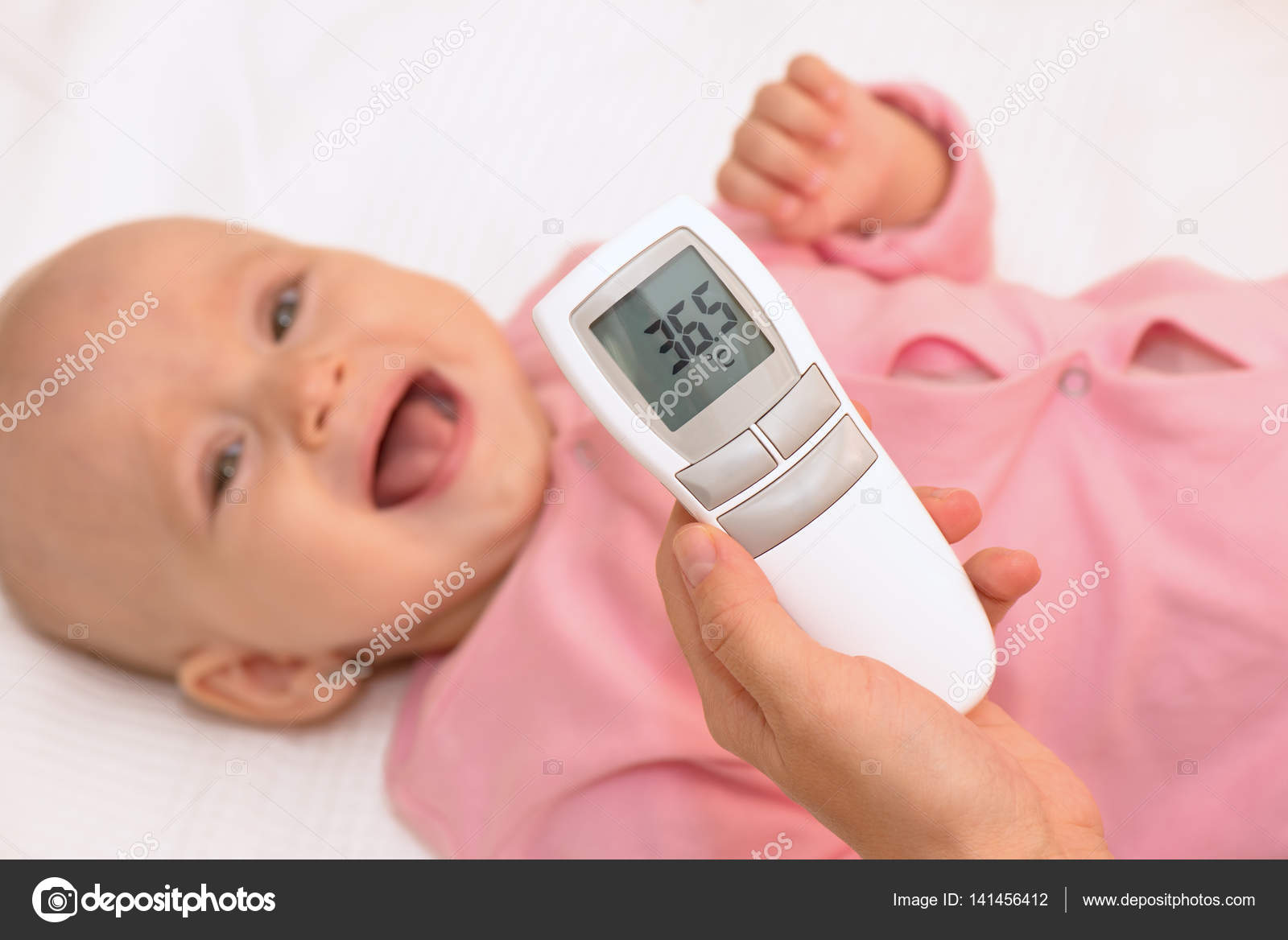 Mother measuring babys temperature Stock Photo by ©ARTSHOTPHOTO 141456412