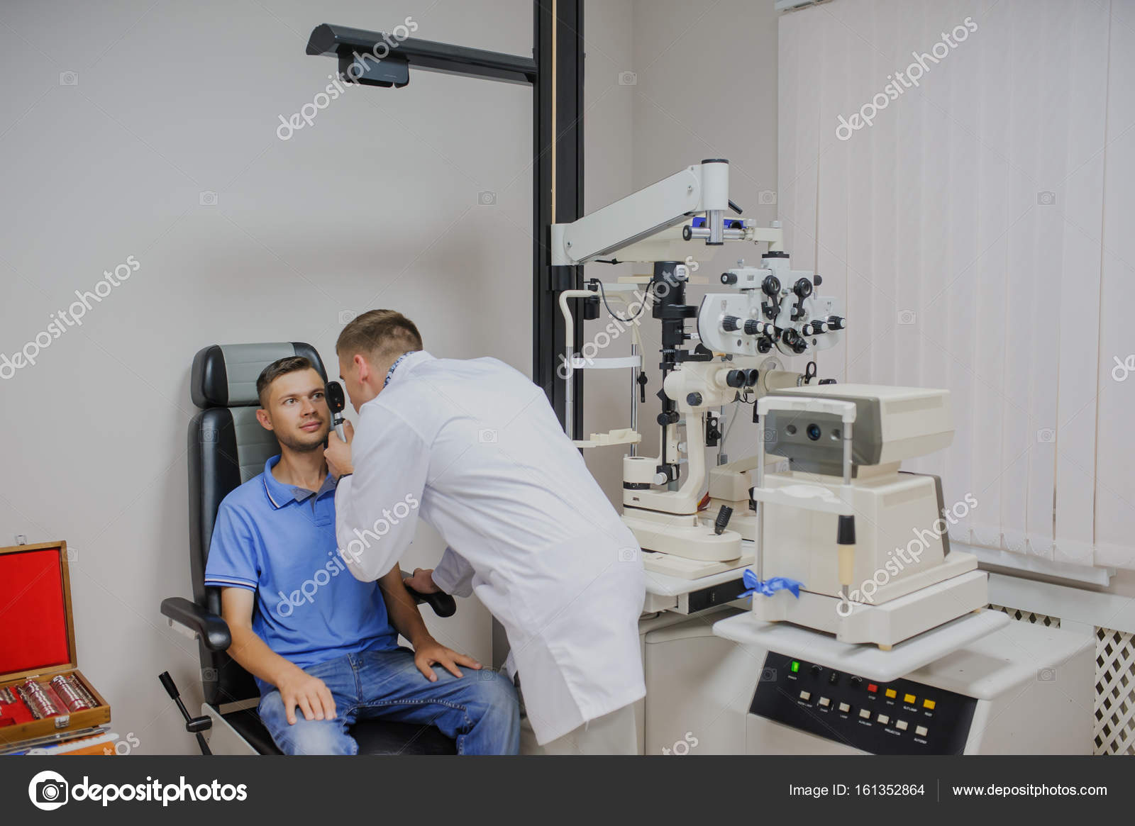 Young beautiful doctor/eye specialist/optometrist in an ophthalm ...