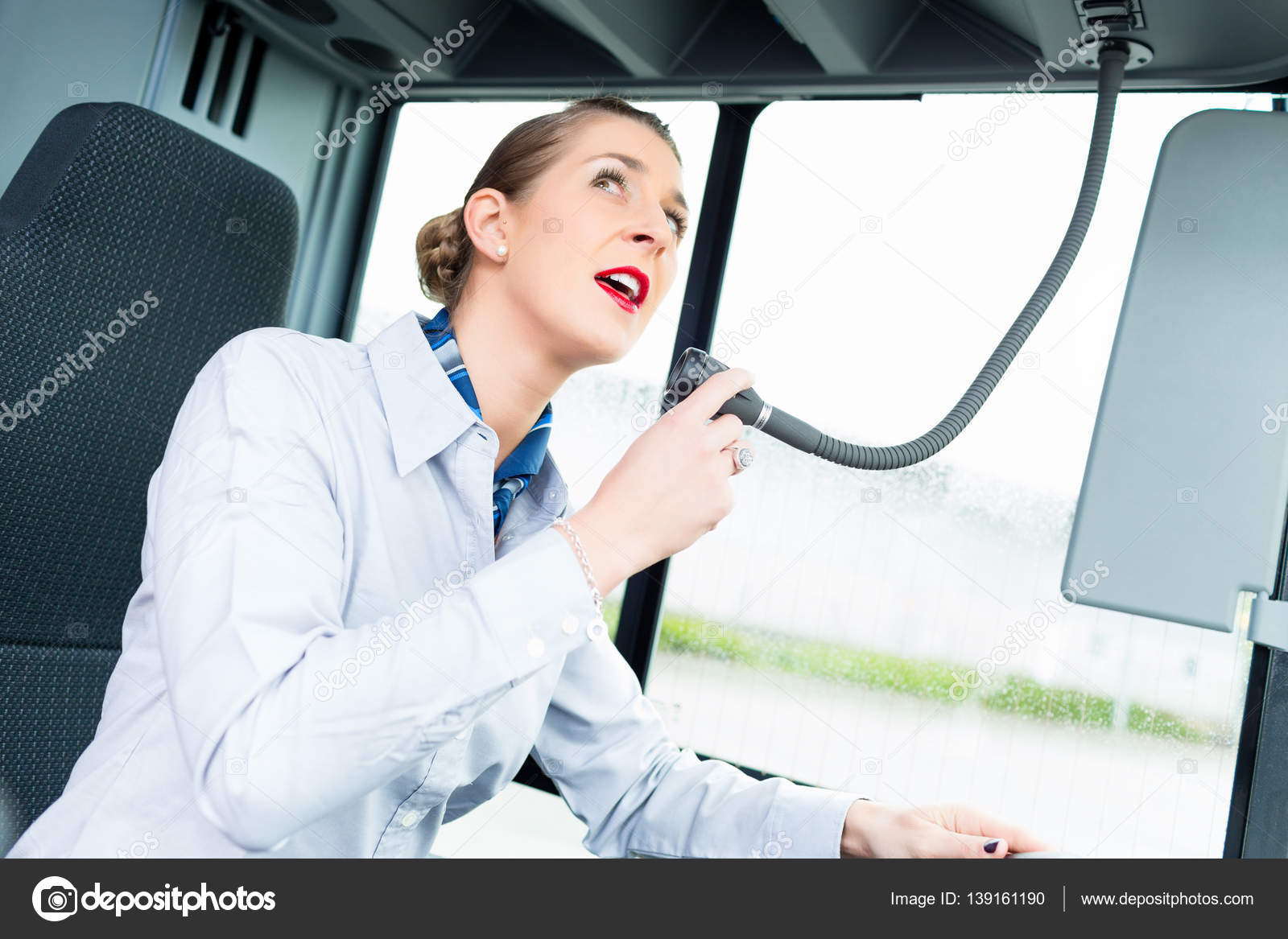 Bus driver woman speaking into the microphone Stock Photo by ©Kzenon ...