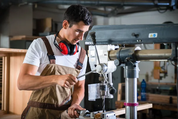Cabinet maker working on power drill - Stock Image - Everypixel