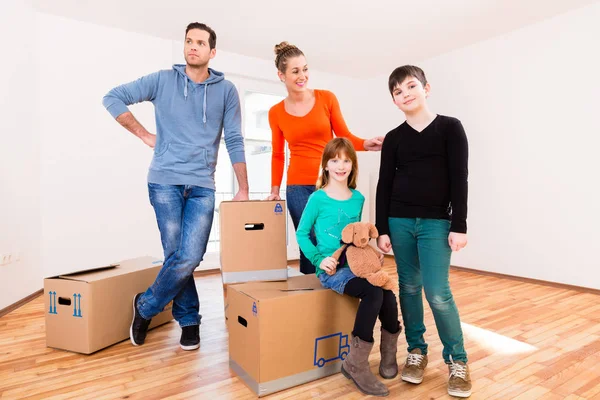 Family with moving boxes - Stock Image - Everypixel