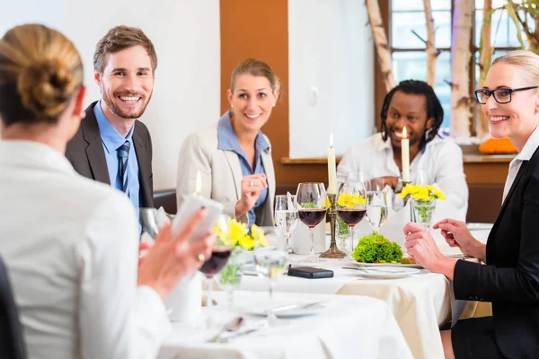 Team at business lunch meeting in restaurant Stock Photo by ©Kzenon ...