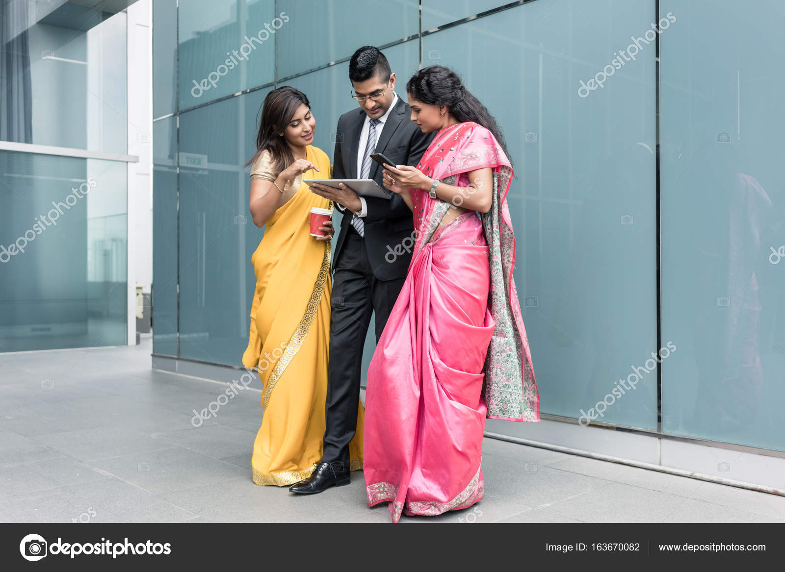 Indian people using devices Stock Photo by ©Kzenon 163670082