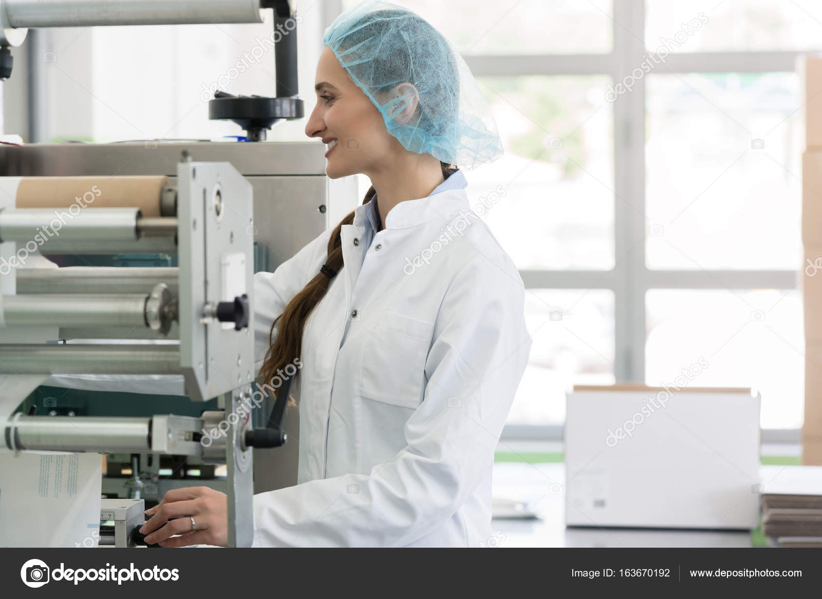 Manufacturing operator working with modern equipment Stock Photo by ...