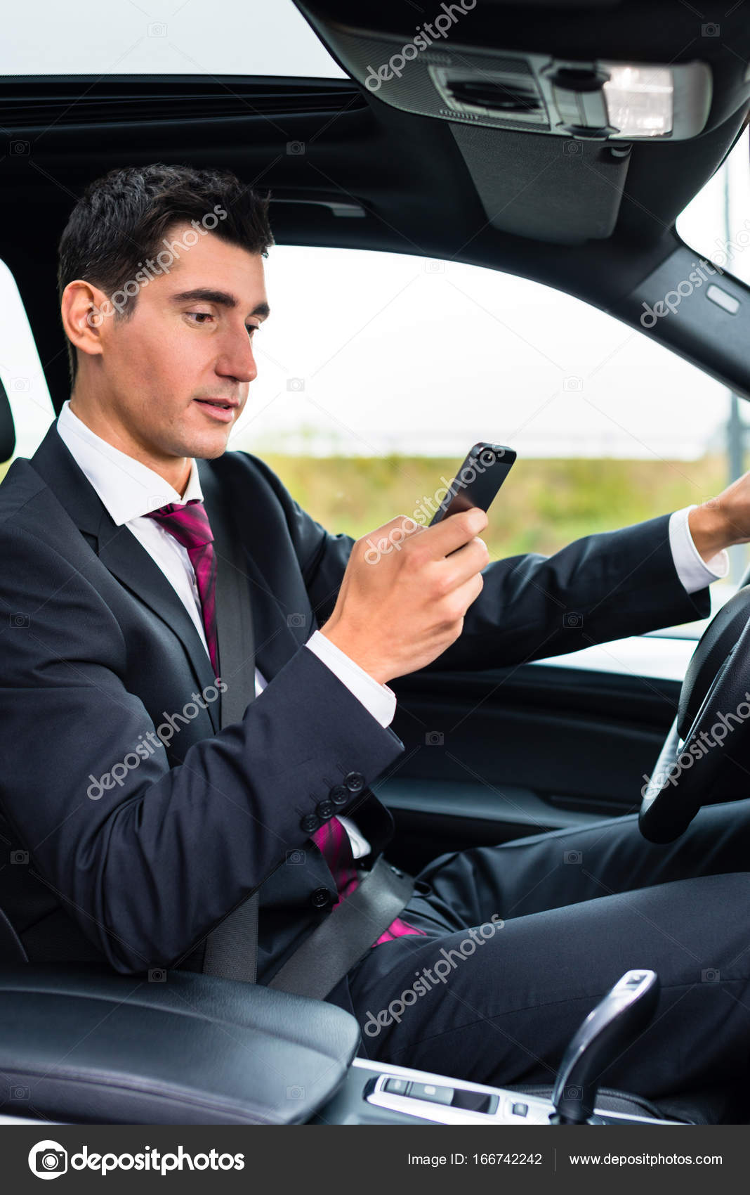 Man texting while driving by car — Stock Photo © Kzenon #166742242