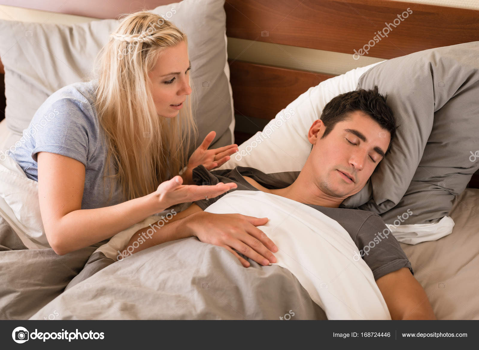 Indifferent man sleeping in bed next to his partner Stock Photo by ...