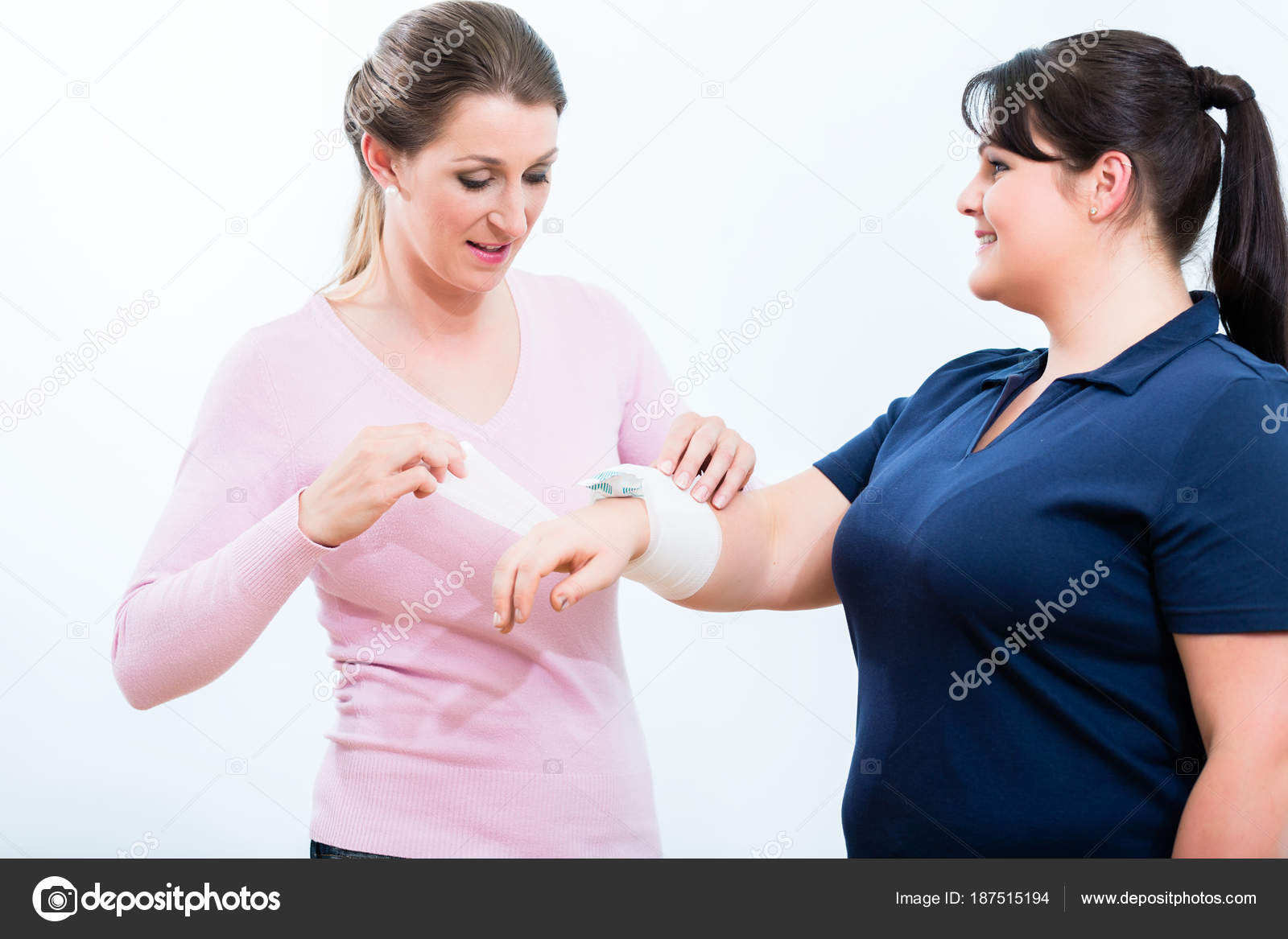 Women in First aid course learning to apply bandage Stock Photo by ...