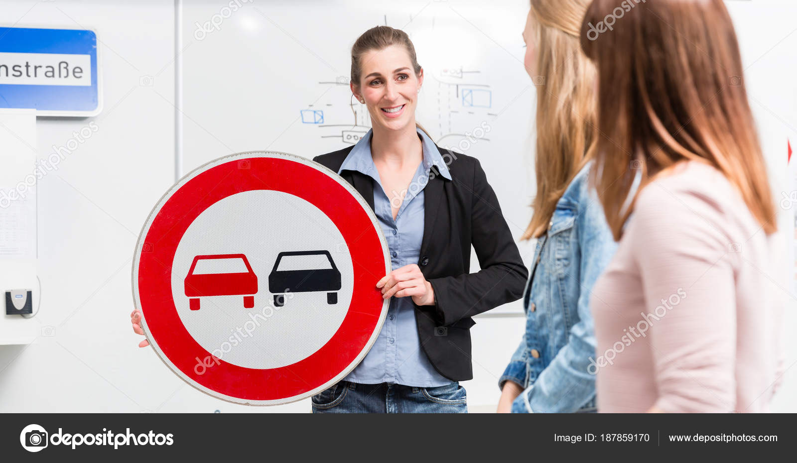 Learner in driving lessons theory explaining traffic situation Stock ...