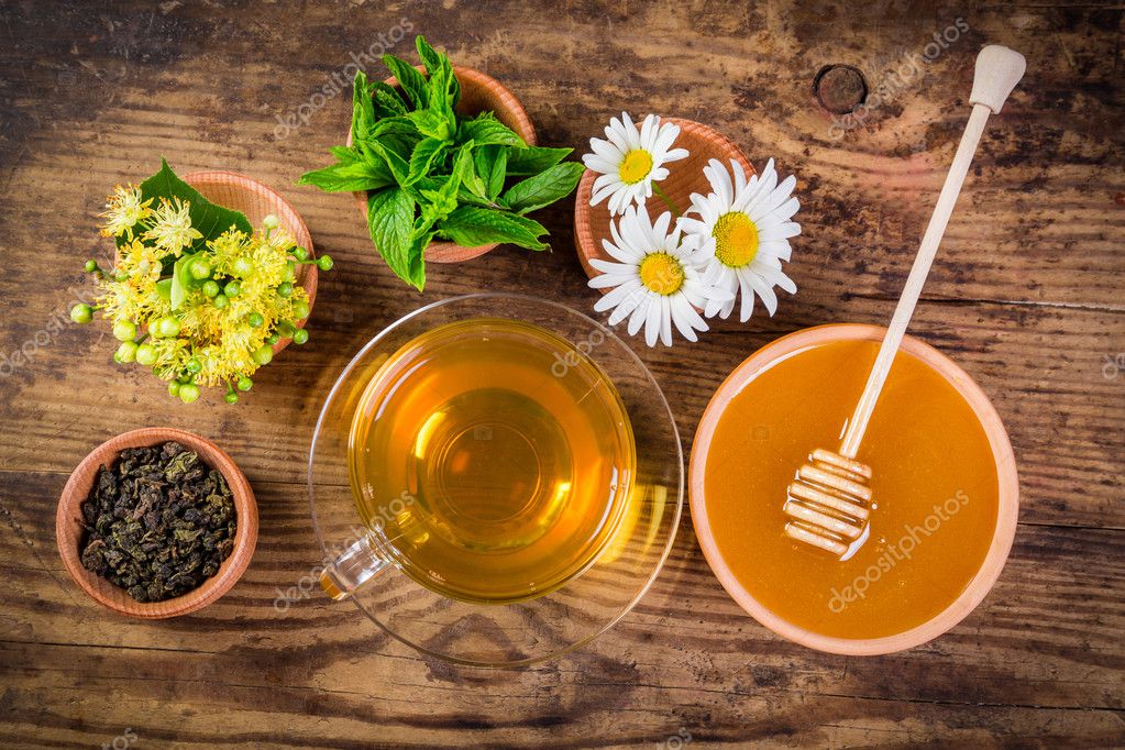 Green tea with mint, chamomile, jasmine flowers and honey — Stock Photo © sbworld7 #127976754