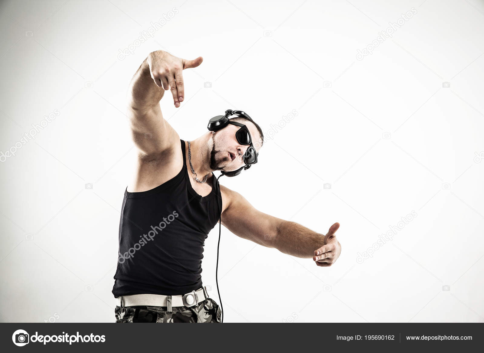 Emotional and charismatic DJ - rapper in headphones takes the ra ...