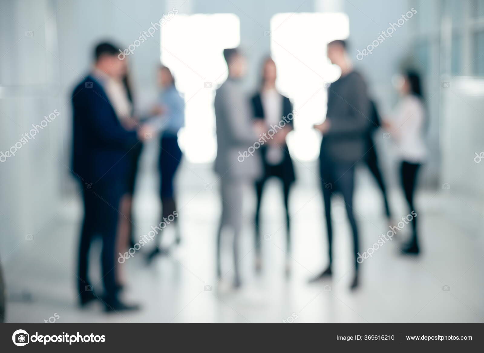 Background image of a group of corporate employees in the office lobby ...