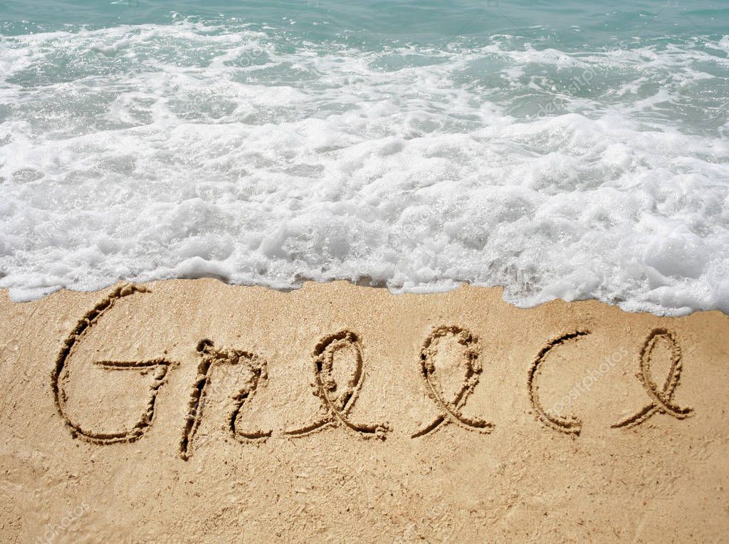 Handwritten Greece text in sand — Stock Photo © design36 #129360394
