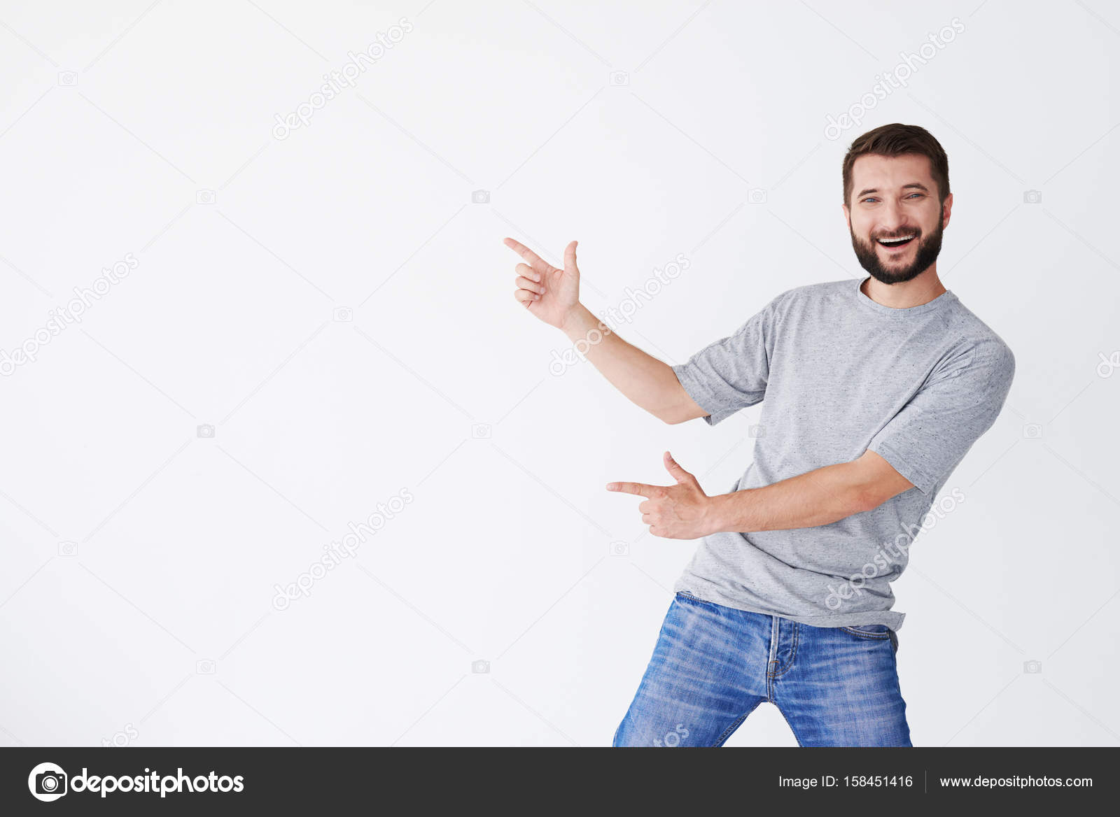 Guy pointing on white background Stock Photo by ©konstantynov 158451416