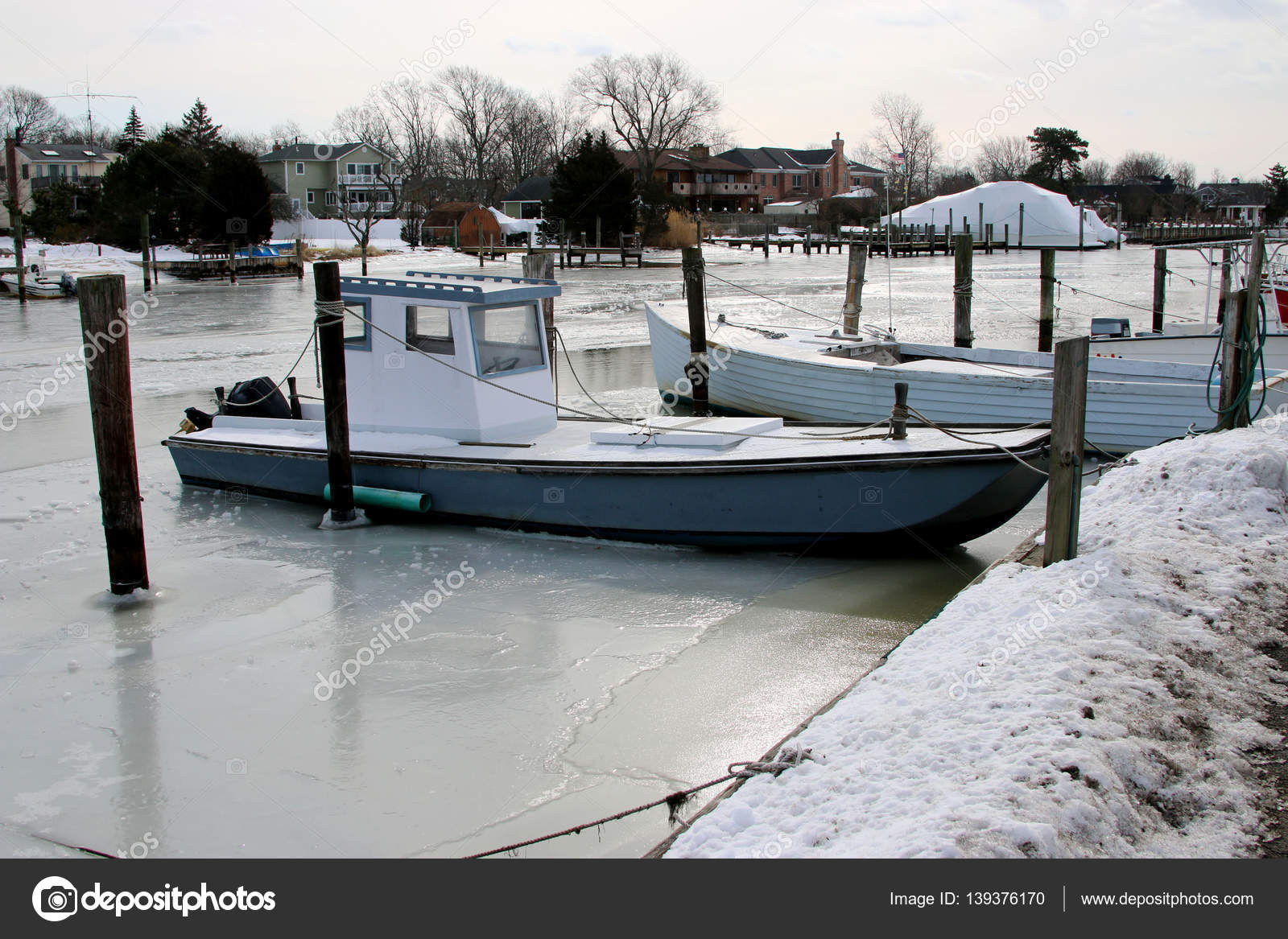 Clam boat frozen in a harbor — Stock Photo © WoodysPhotos #139376170