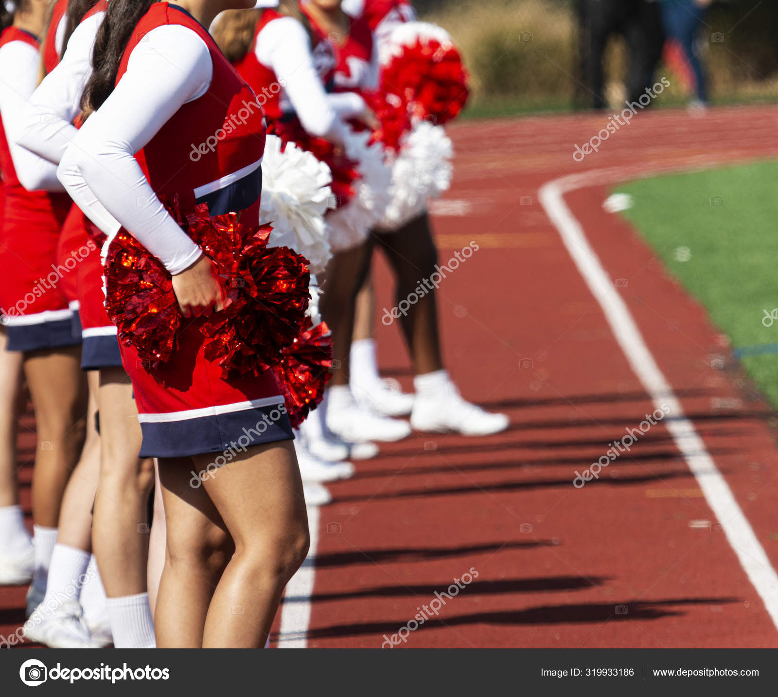 Cheerleaders on the track during a football game — Stock Photo ...