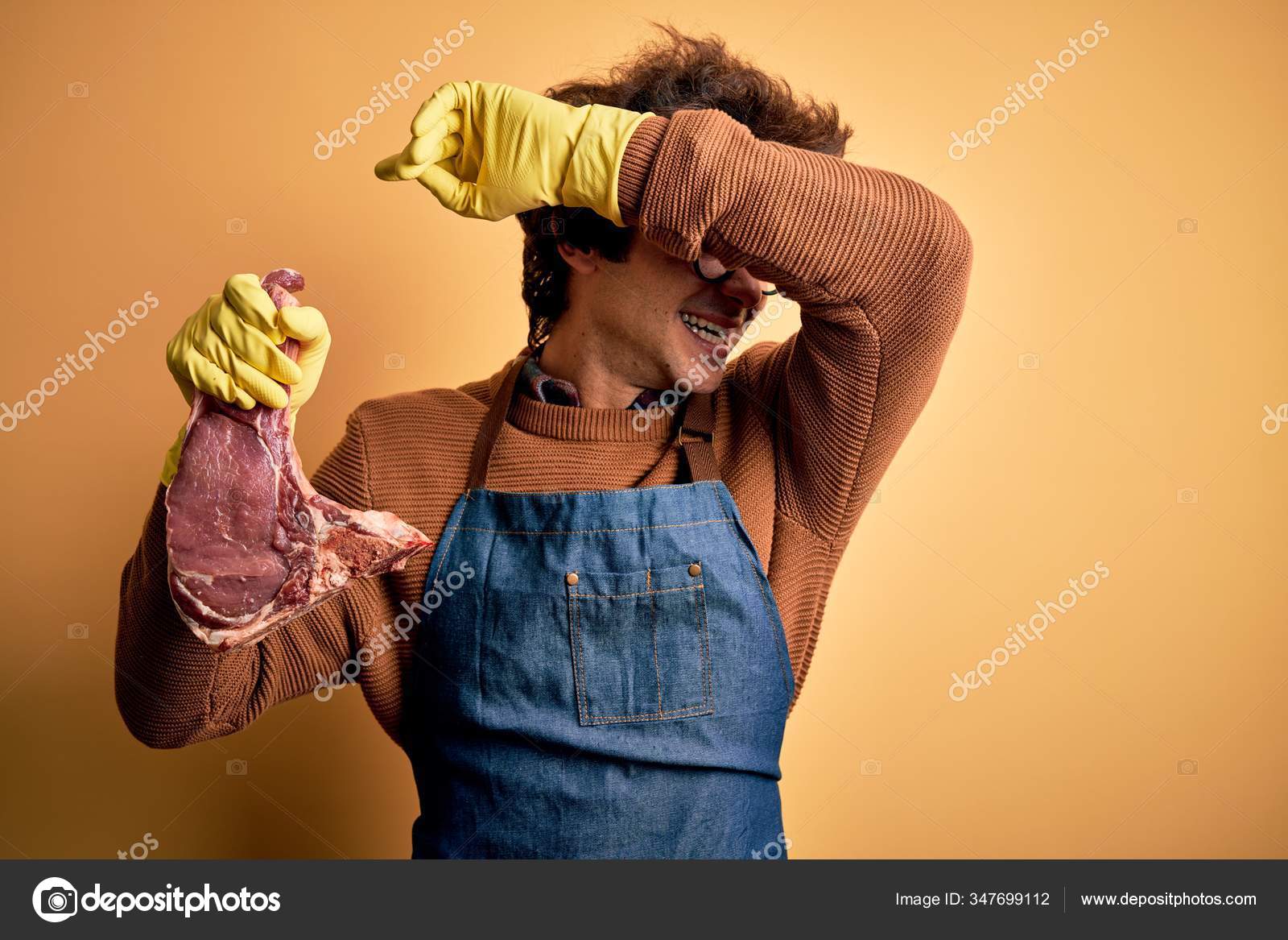 Young Handsome Butcher Man Holding Meet Steak Standing Isolated Yellow ...