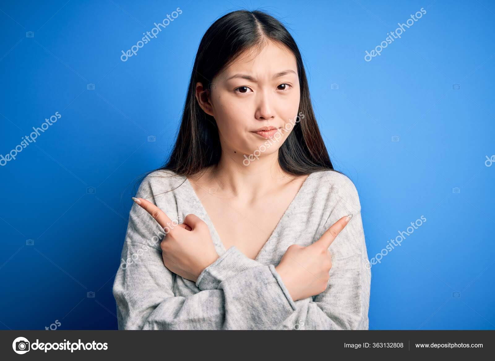 Young Beautiful Asian Woman Wearing Casual Sweater Standing Blue ...